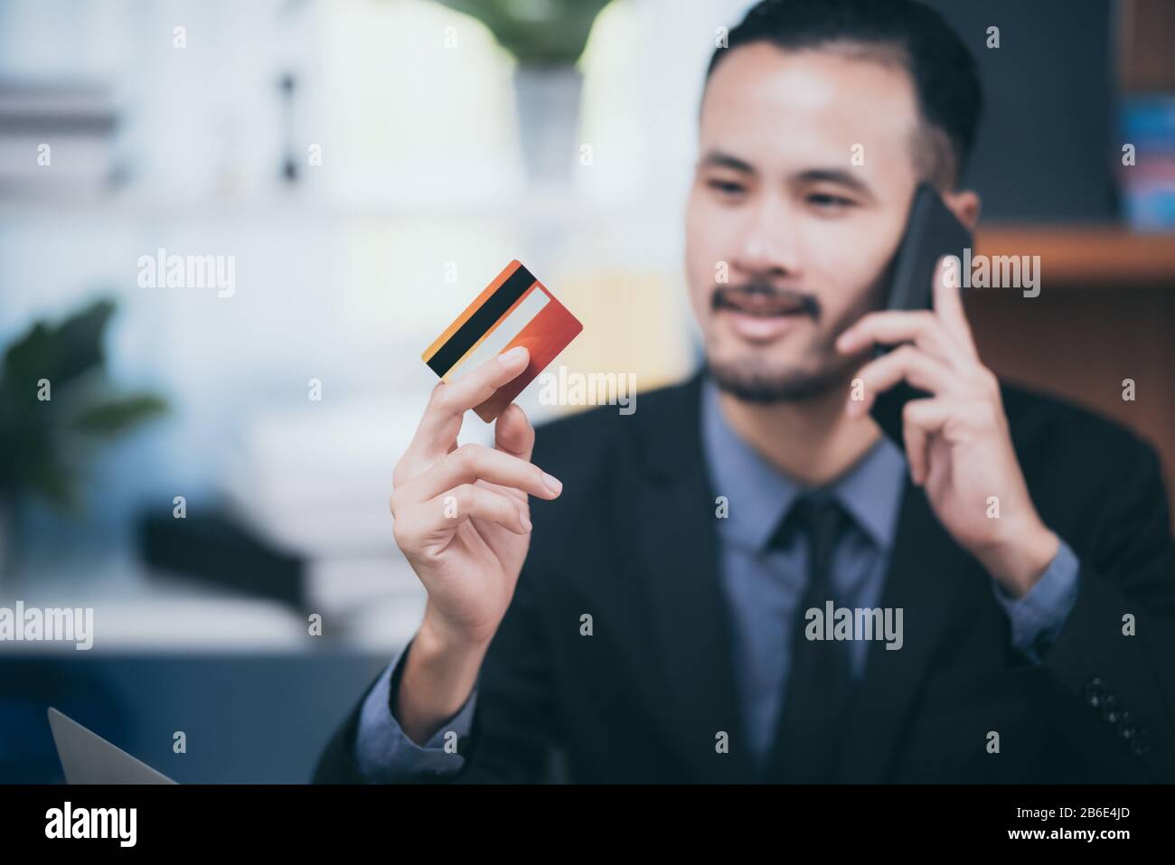 Business people use credit cards to do financial transactions at work ...