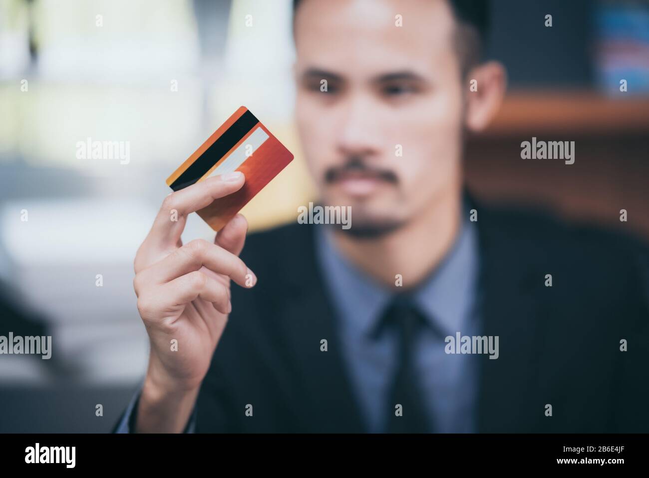 Business people use credit cards to do financial transactions at work ...