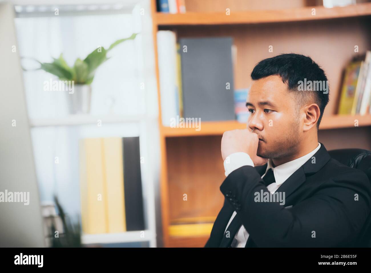 A smart business man who is working on a desk plan Stock Photo - Alamy