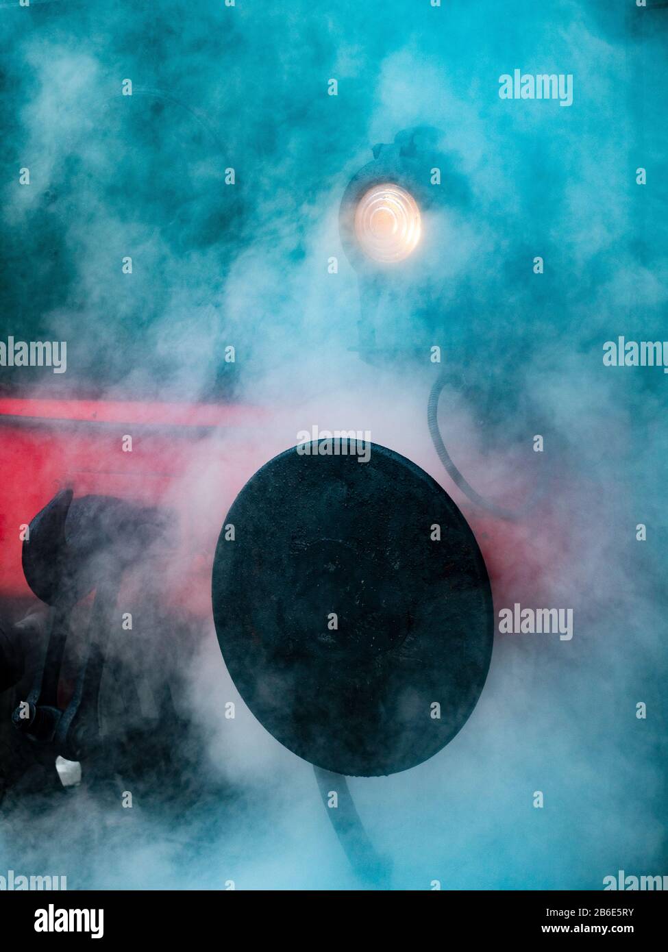 Closeup of a steam engine buffer wreathed in steam Stock Photo - Alamy