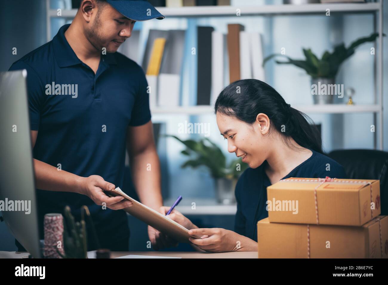 Business people are checking marketing documents Stock Photo - Alamy
