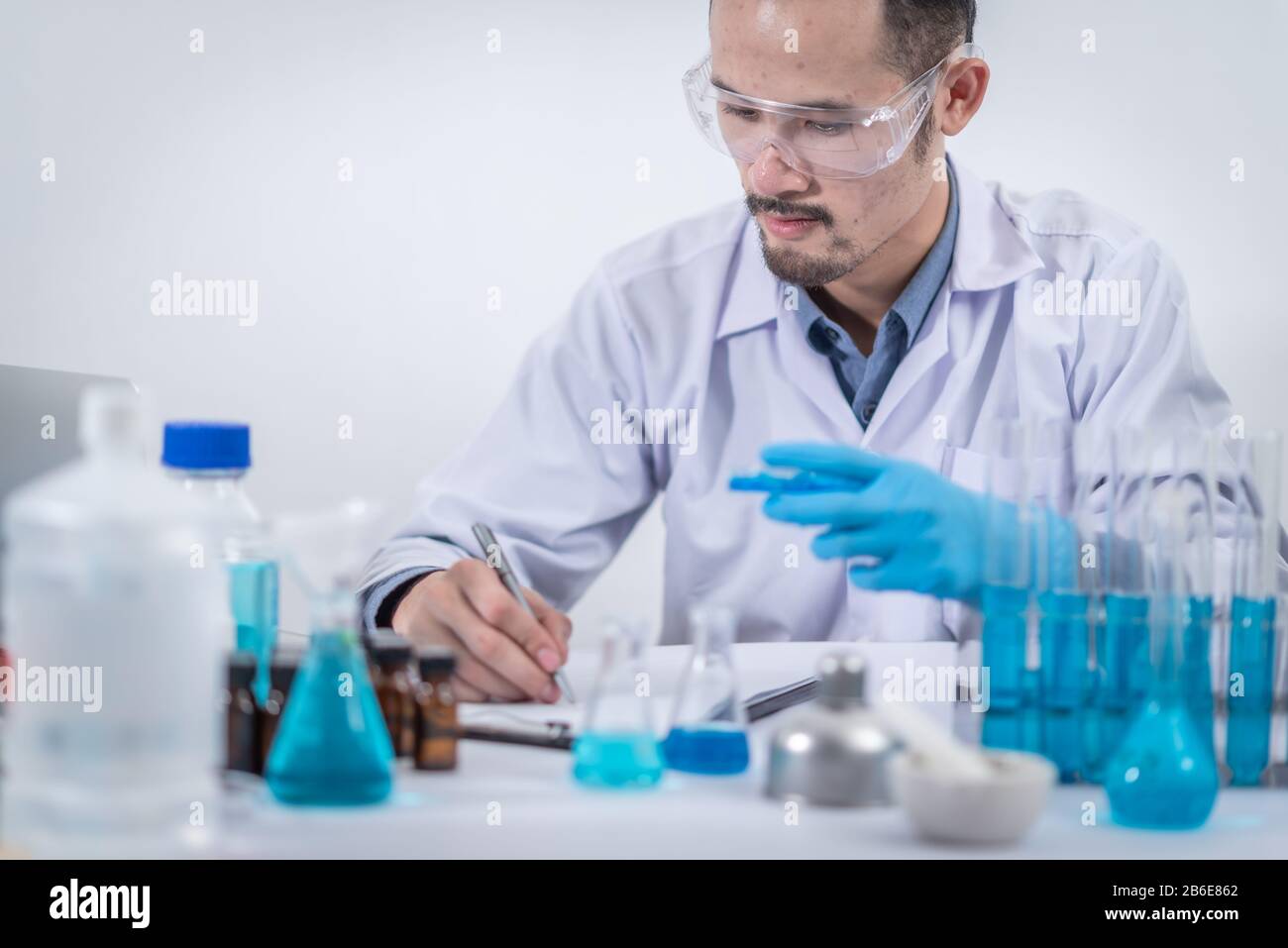 Scientists are doing research in a chemical laboratory Scientific ...
