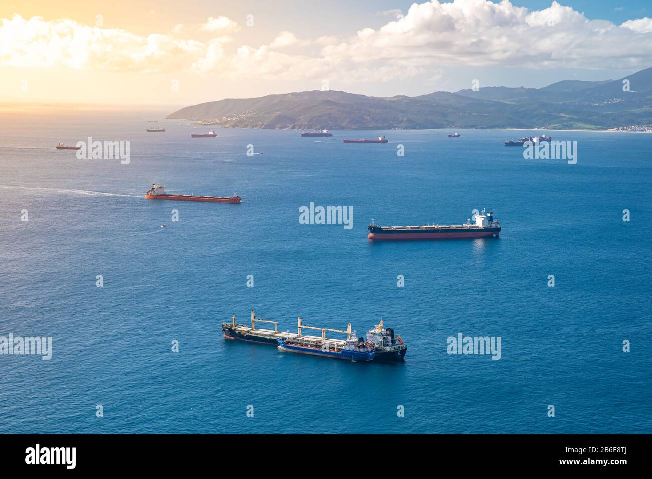 Cargo ships with containers, goods are transported via sea Stock Photo ...