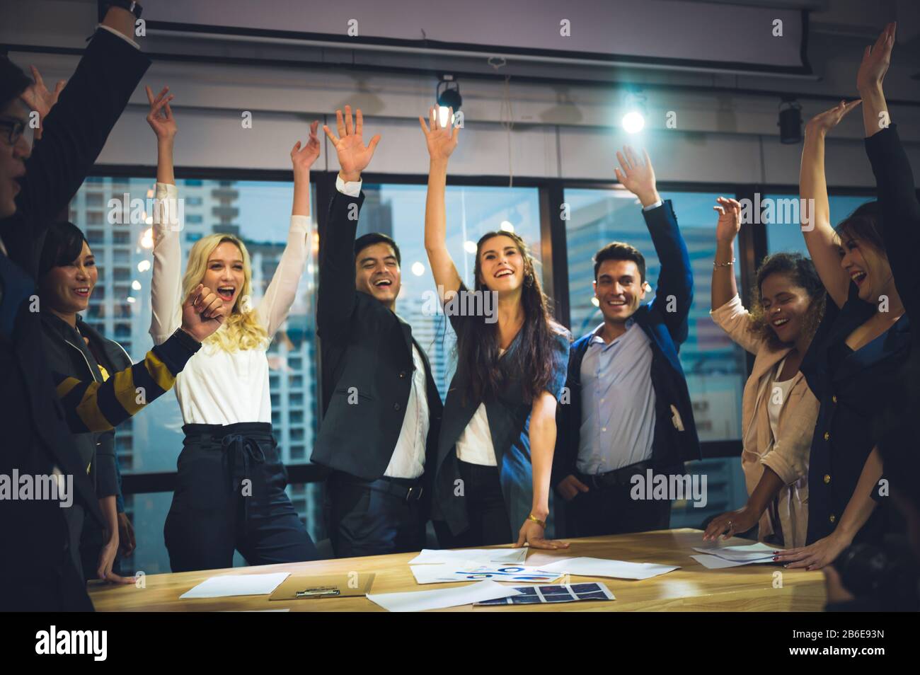 Large business team showing unity with their hands together Stock Photo ...