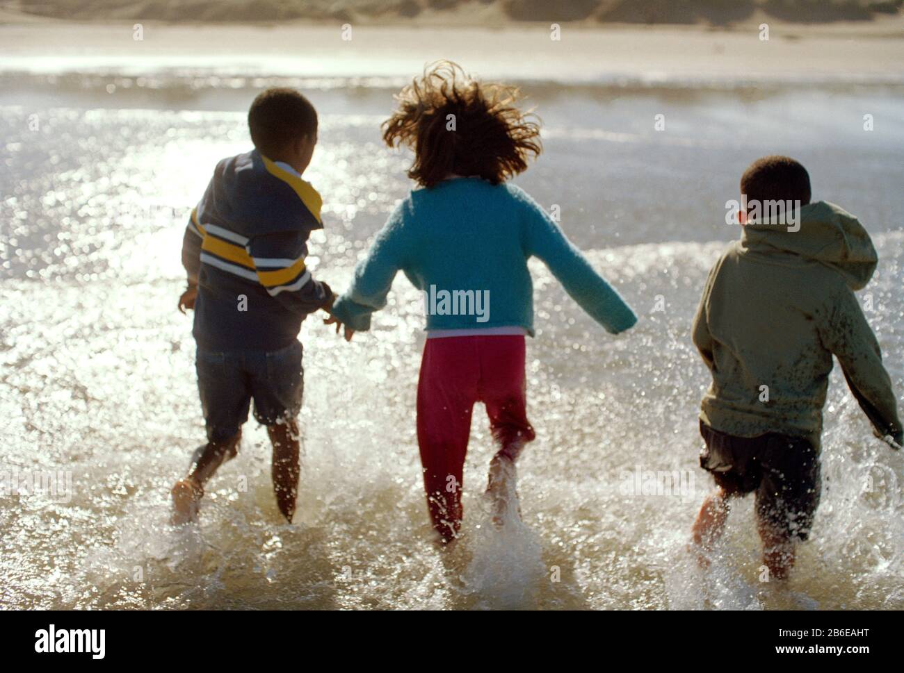 African boy running through water hi-res stock photography and images ...