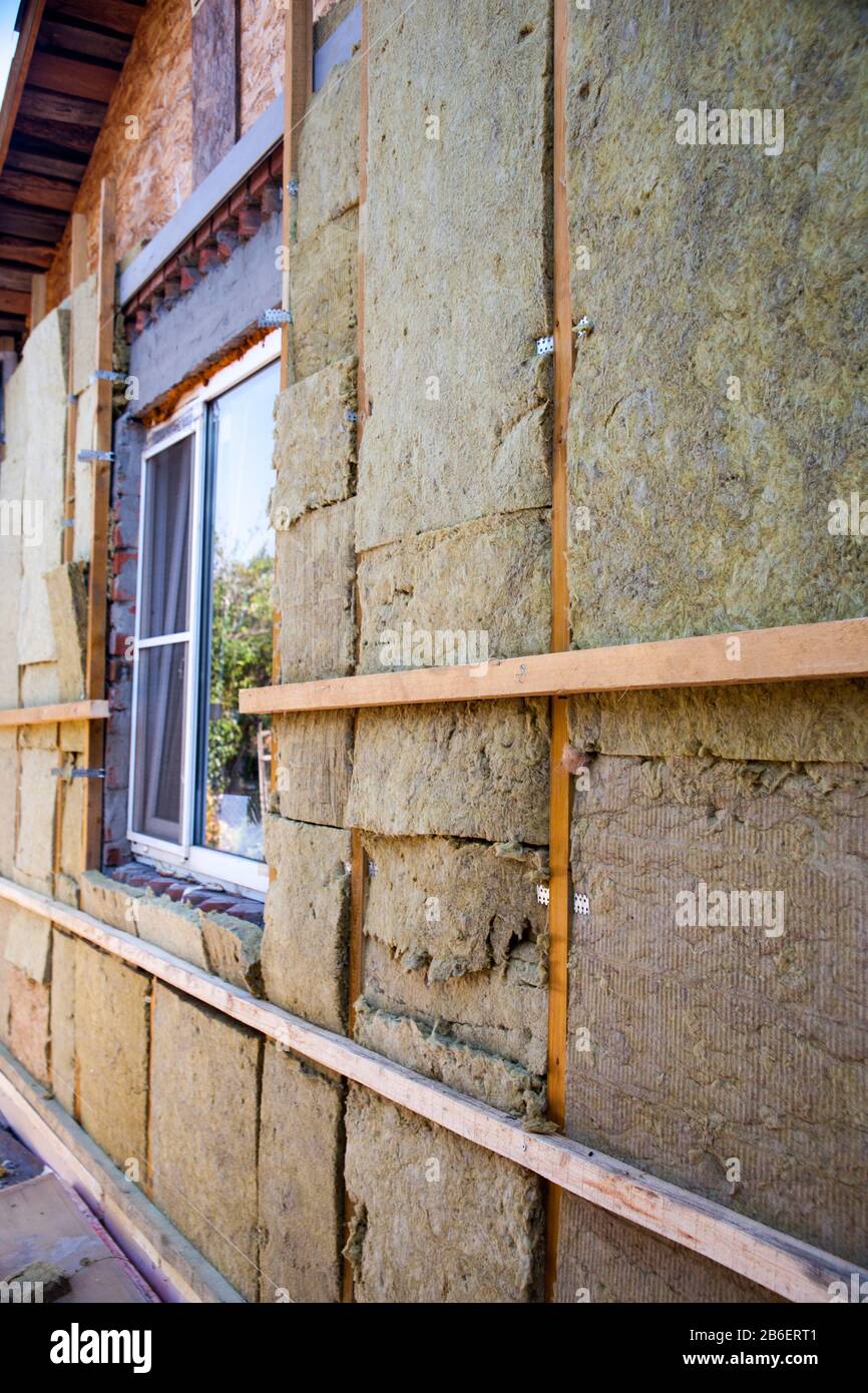 warming the walls of a stone house with a stone wool heater. Ecological ...