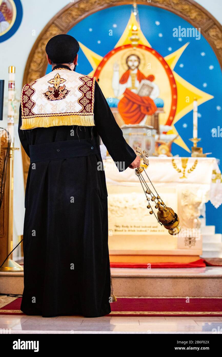 Priest performing church ceremony with Thurible christian accessory ...
