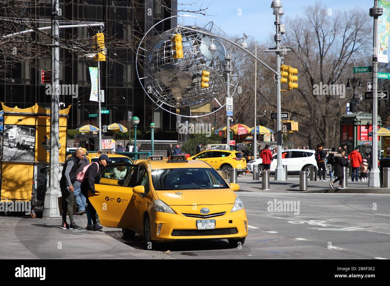 Moving yellow cabs in Columbus Cirque across from Central Park in New ...