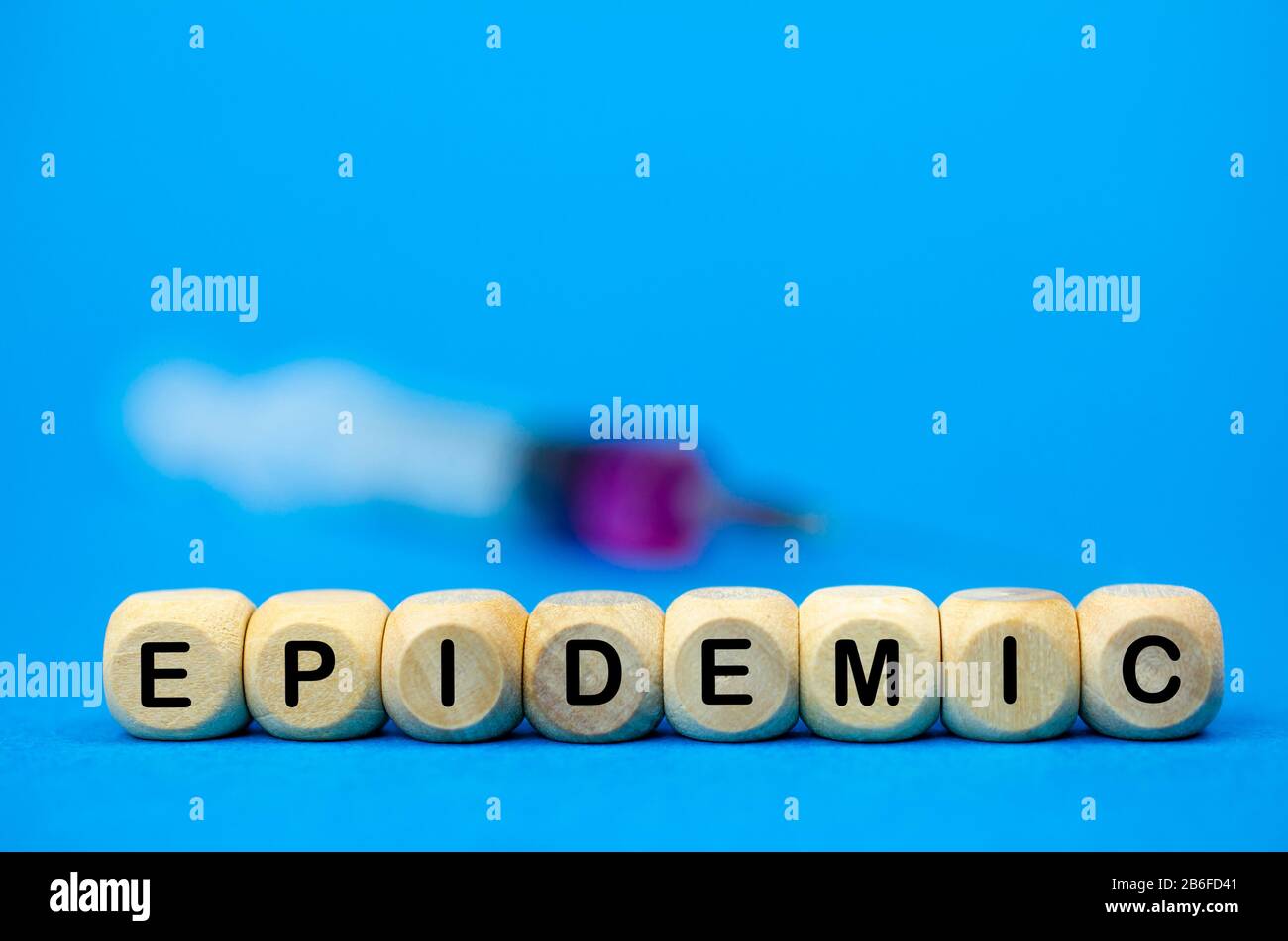 The sign Epidemic on wooden cubes and syringe.Medical concept, epidemic ...