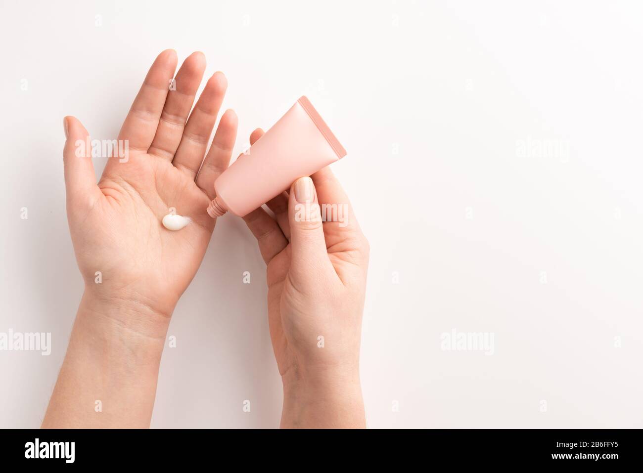 Woman applying cream on hands. Female hands, cosmetic cream, isolated ...
