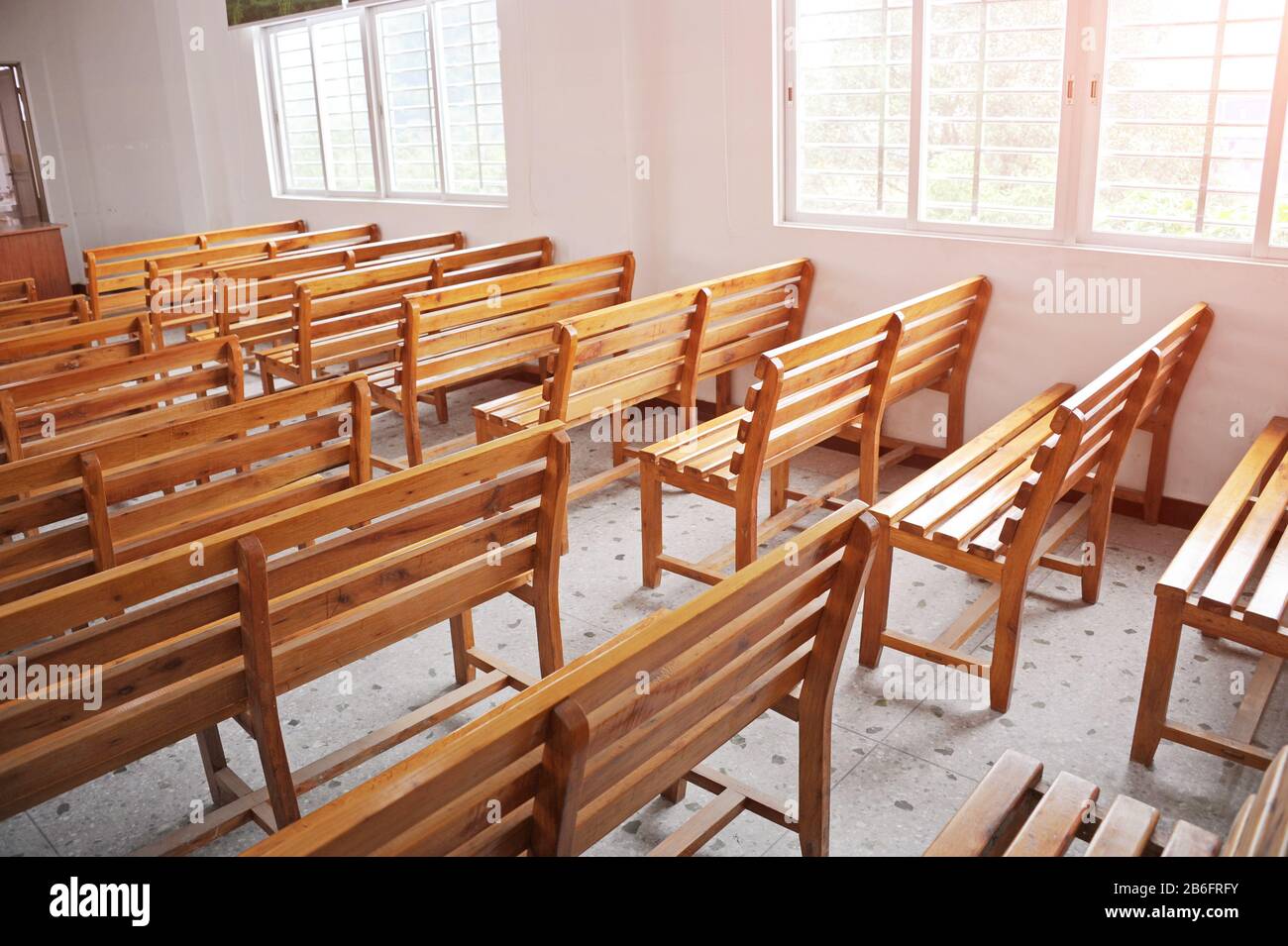 Empty wooden benches in the classroom in rural school, Heyuan ...