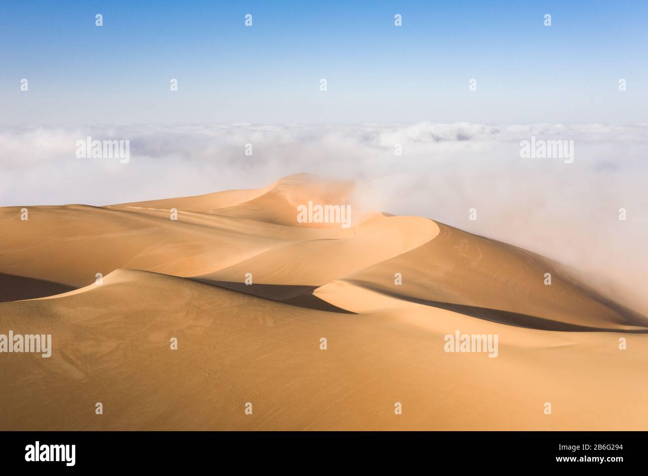 Dense fog covering desert landscape early winter morning. Liwa desert ...