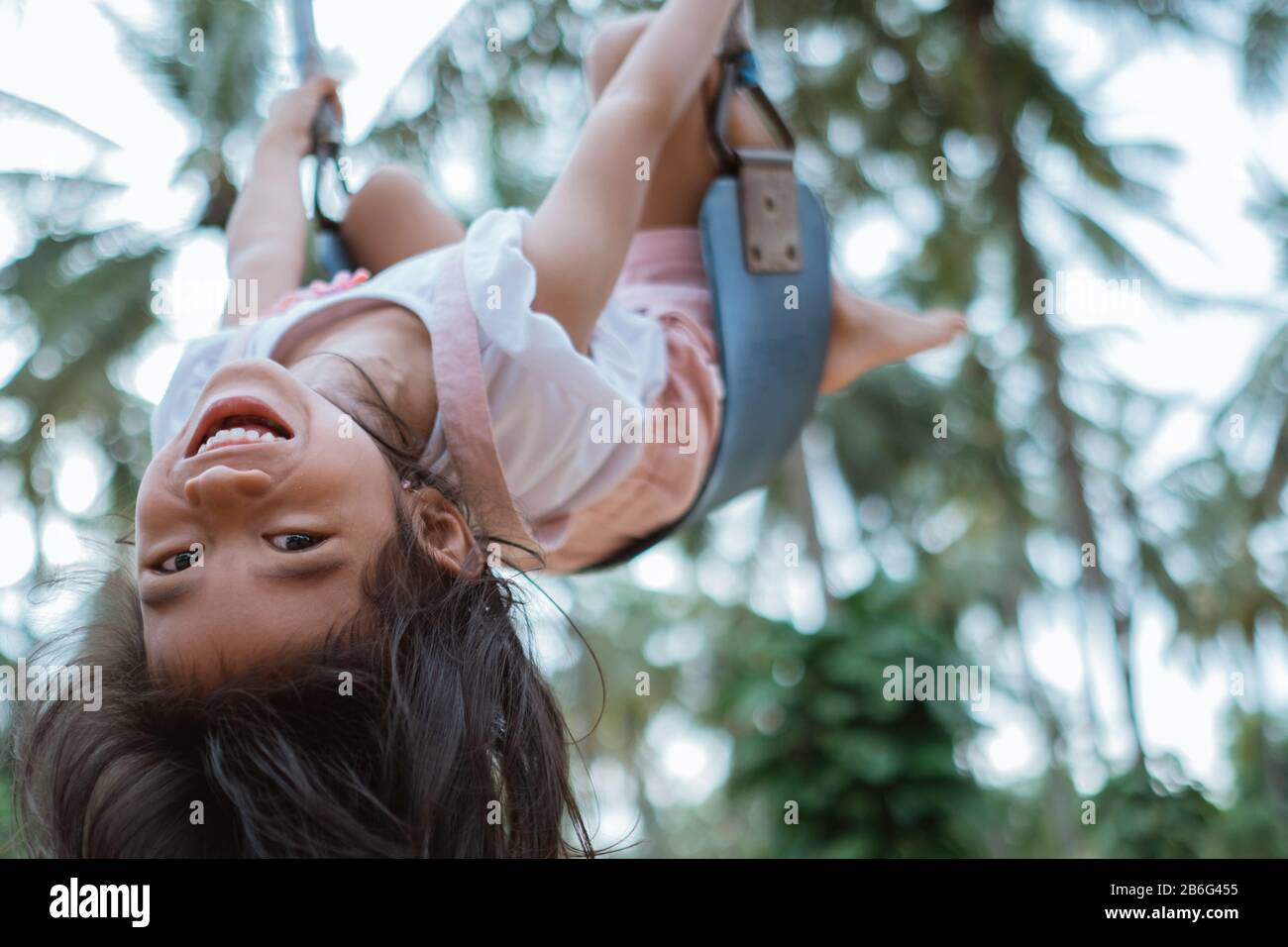 happy kid enjoy playing in the playground Stock Photo - Alamy
