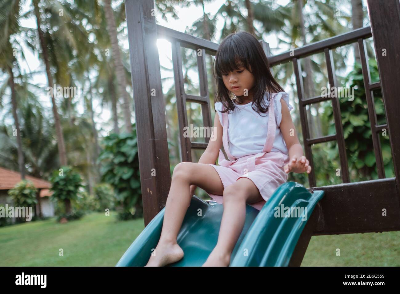 happy kid enjoy playing in the playground Stock Photo - Alamy