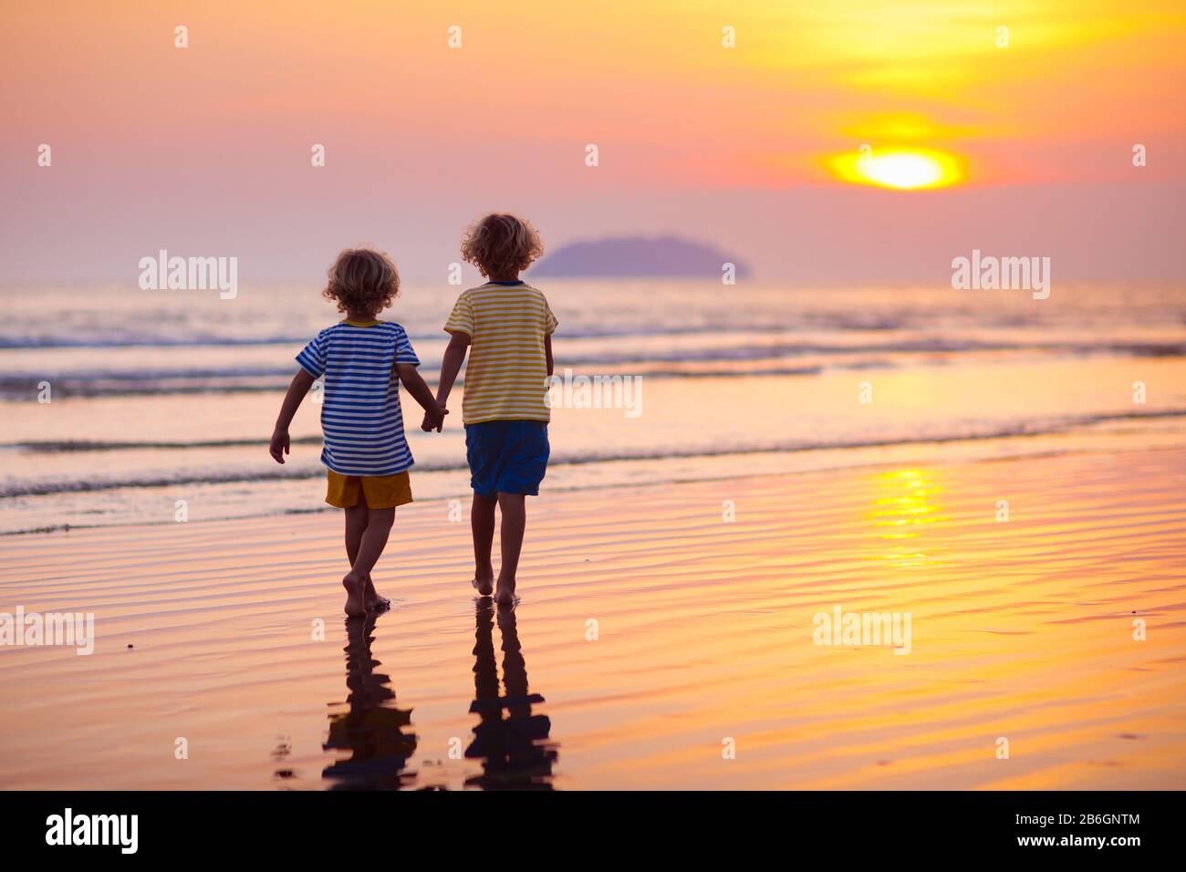 Kids Playing On Beach Sunset High Resolution Stock Photography and ...