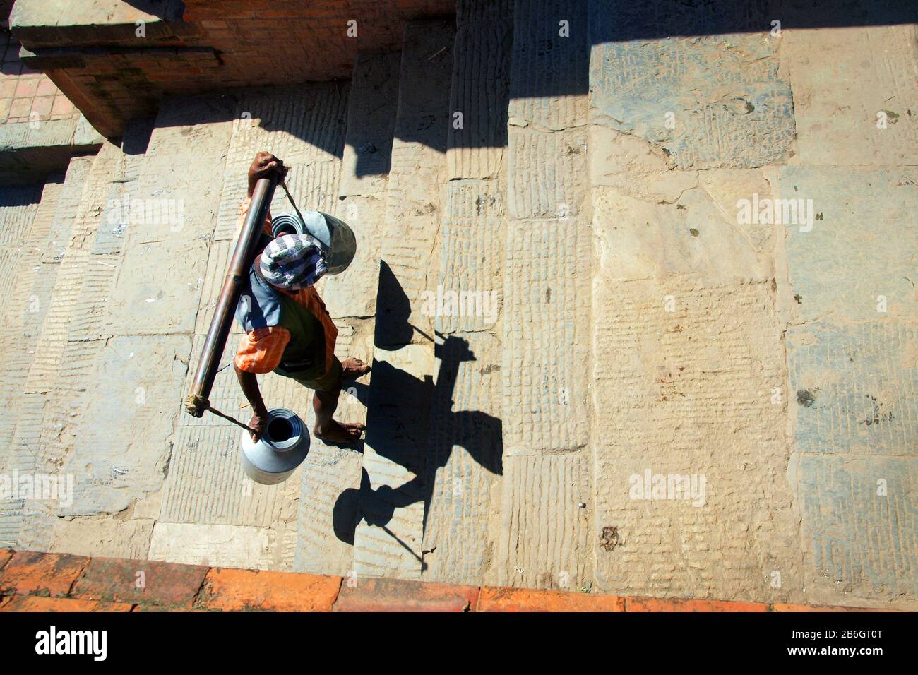 men with his shadow ,carrying water in pot with bamboo stick Stock ...