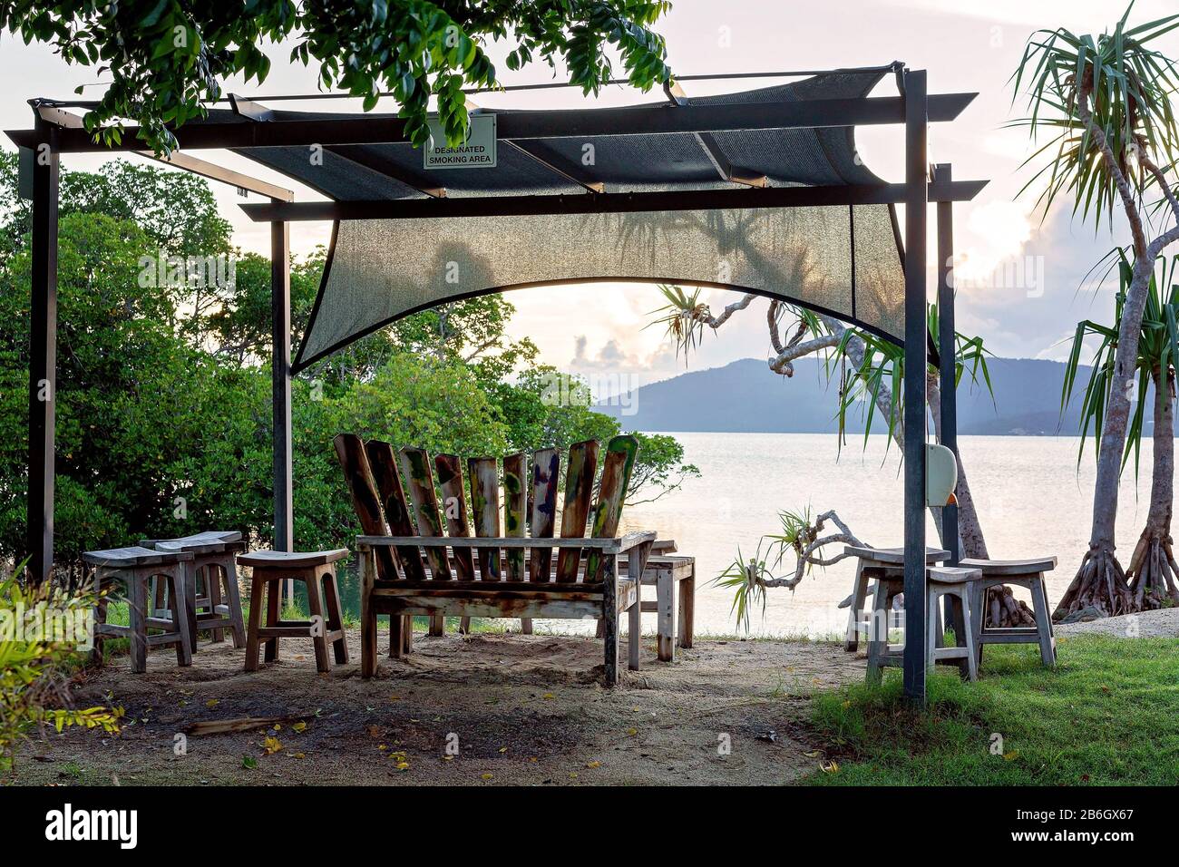 A designated smoking area with seating under shade on the beach Stock ...