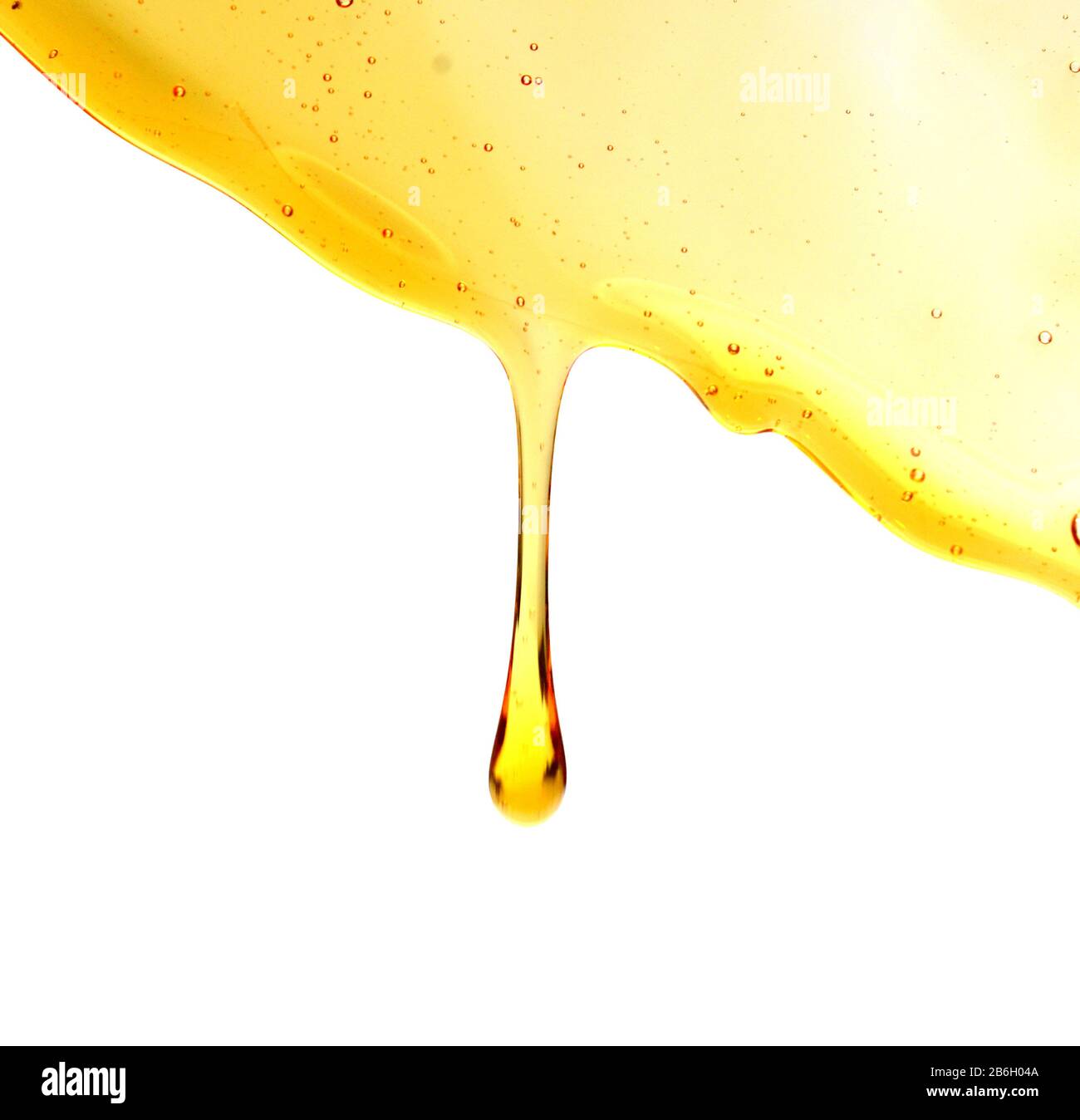 Flow and drop of honey Stock Photo - Alamy