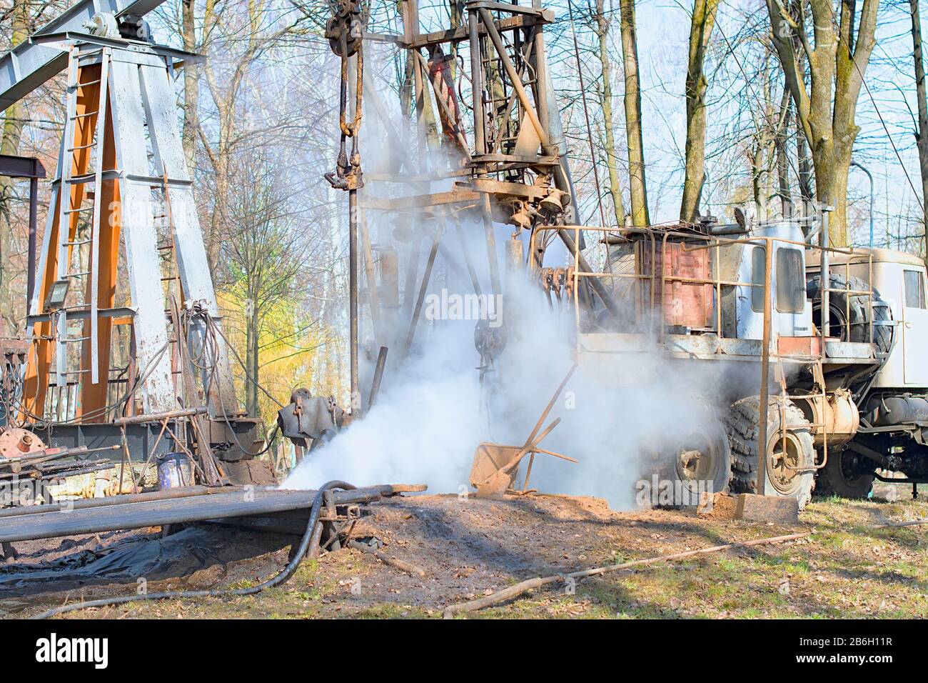 Workover rig working on a previously drilled well trying to restore ...