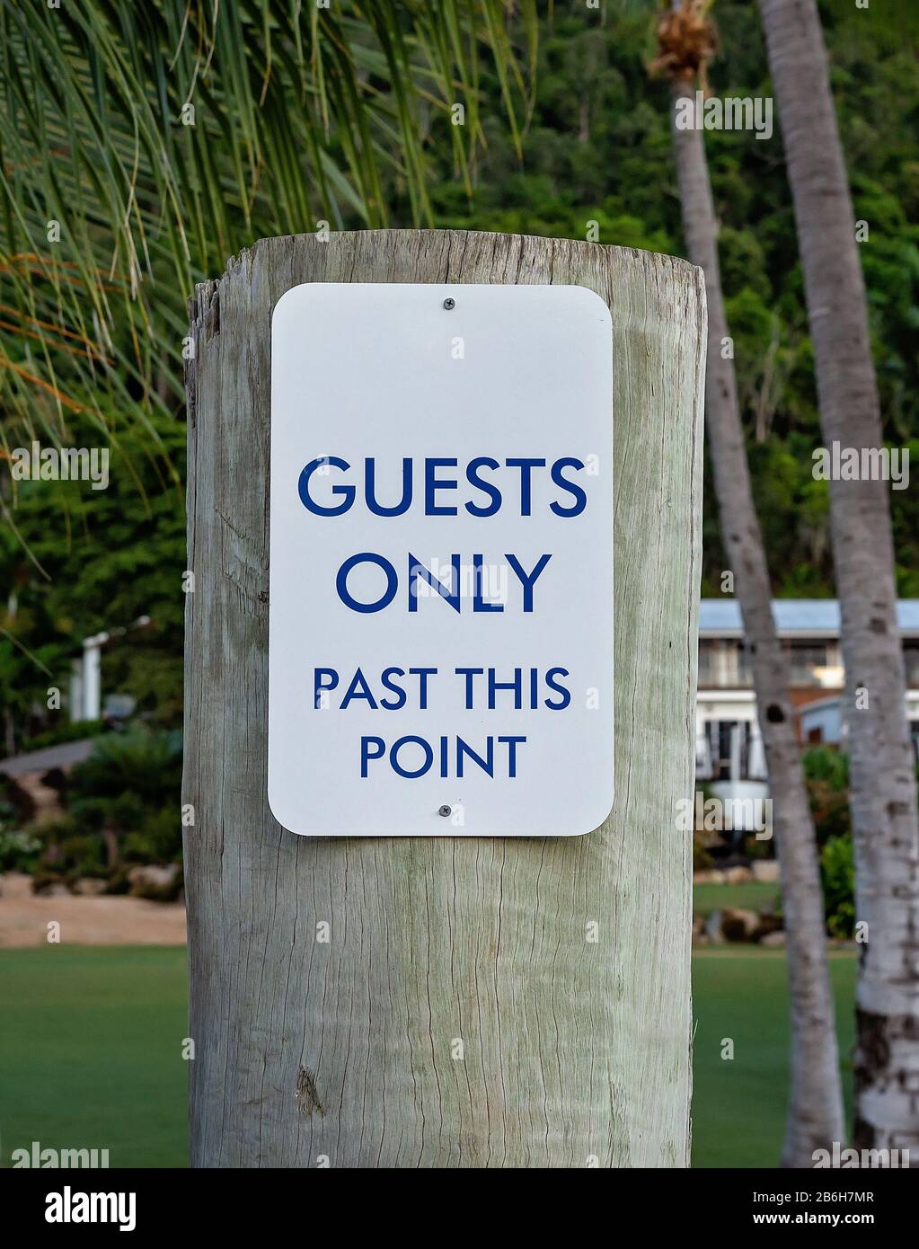 Guests Only Past This Point sign on post warning not to enter private ...