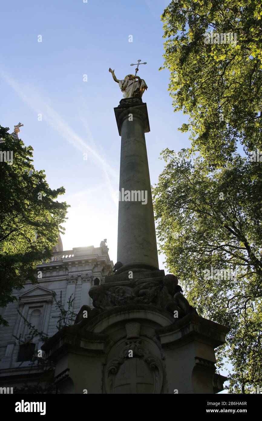 Gilt statue of Saint Paul at the top of St Paul's Cross in the ...