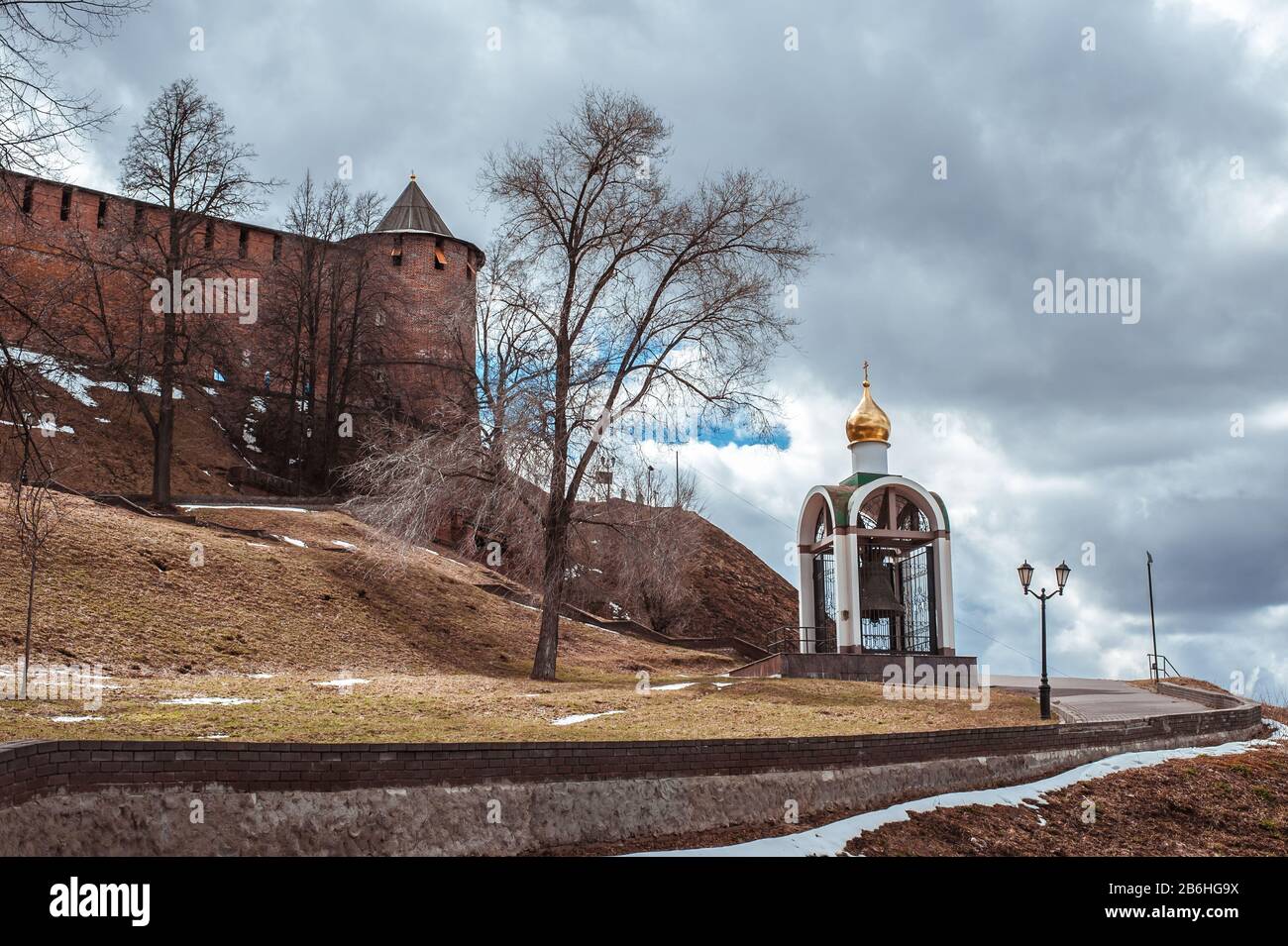 The red brick wall and the north tower of the ancient medieval fortress in Nizhny Novgorod ...
