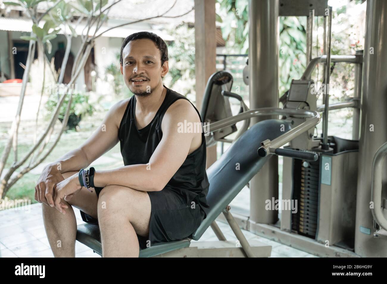 Man sitting alone in gym hi-res stock photography and images - Alamy