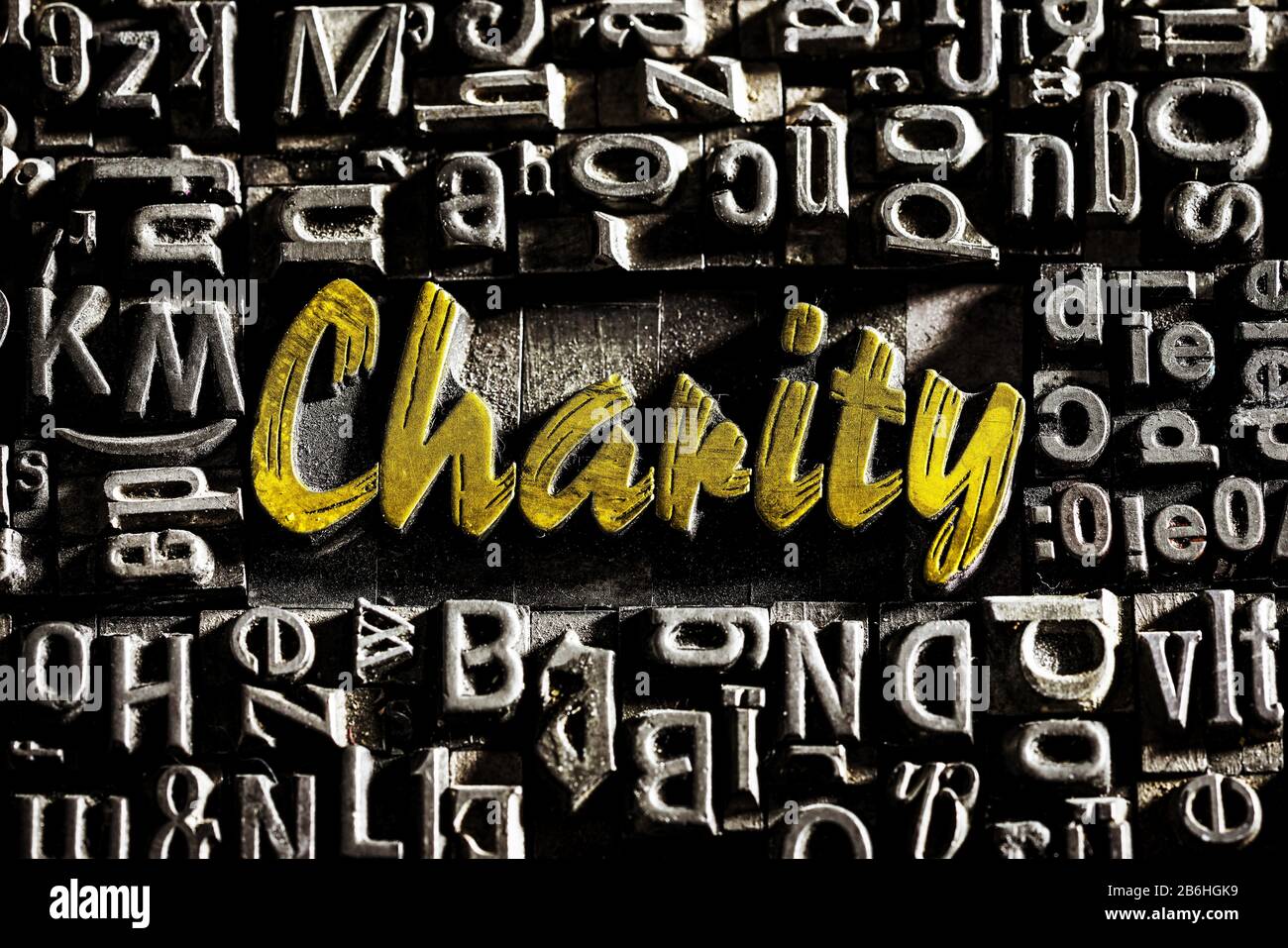 Old lead letters with golden writing show the word Charity, Germany ...