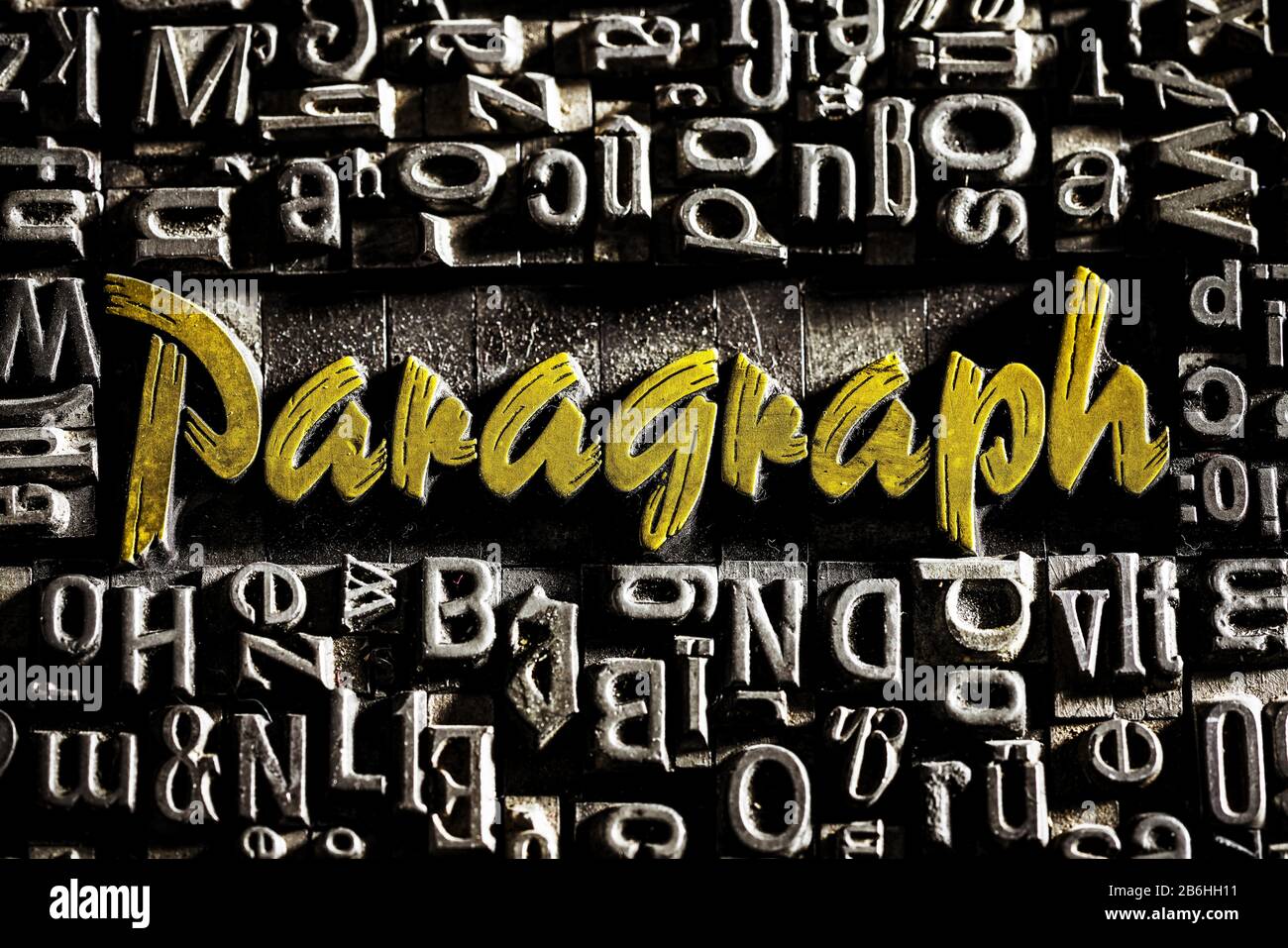 Old lead letters with golden writing show the word paragraph, Germany ...