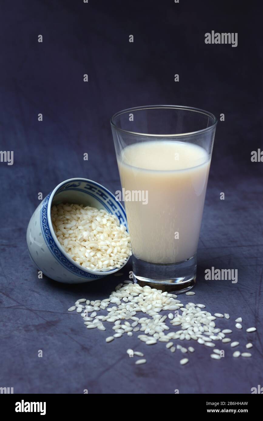 Rice milk in glass and rice grains, Germany Stock Photo - Alamy