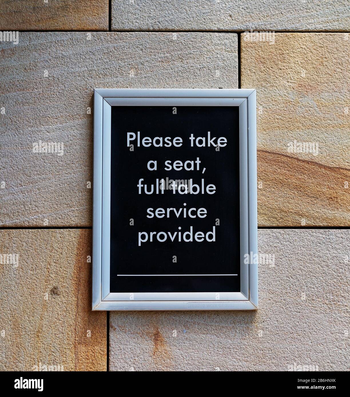 Please take a seat, full table service provided sign Stock Photo - Alamy