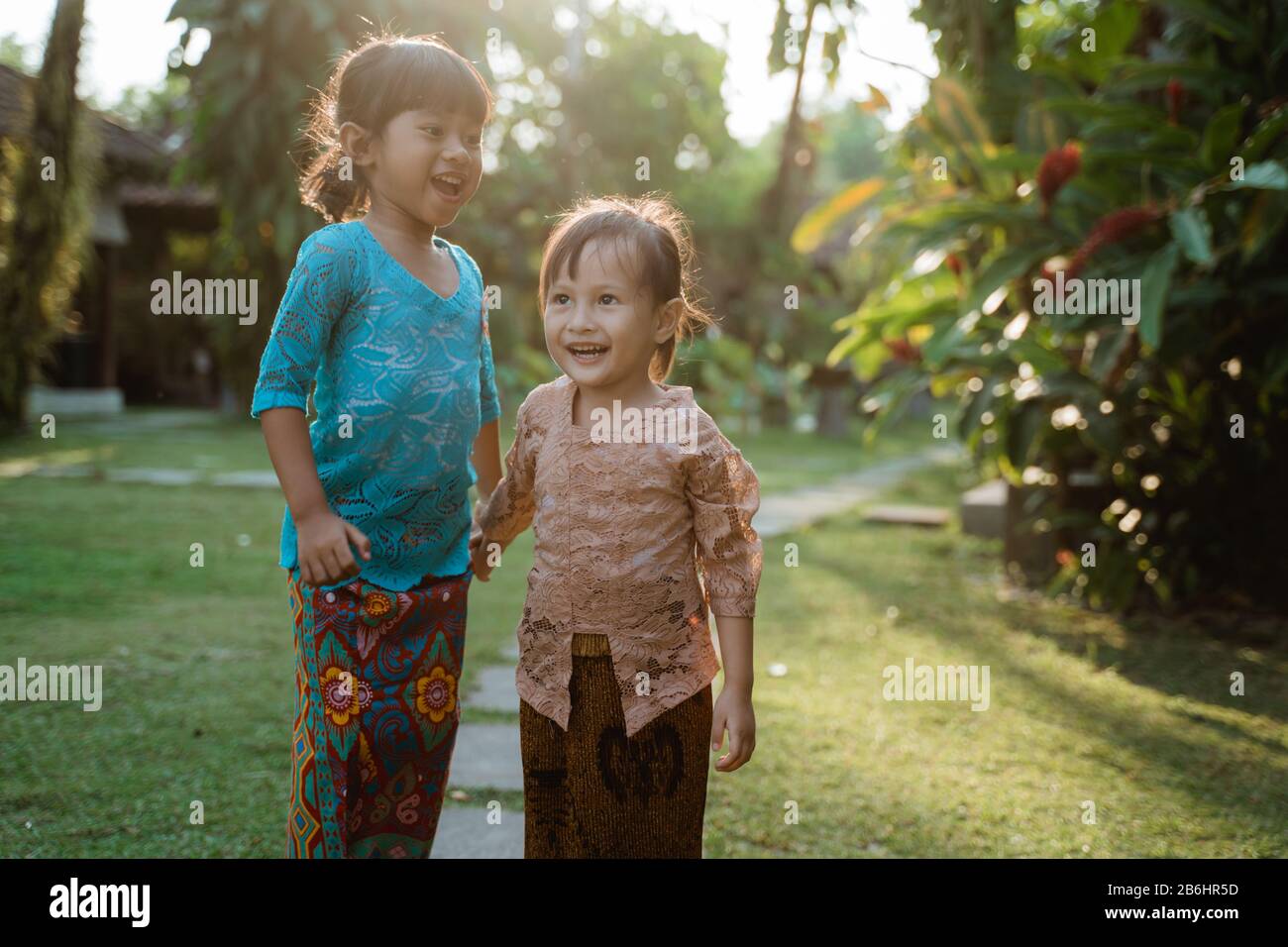happiness two pretty girl wearing traditional javanese kebaya with ...