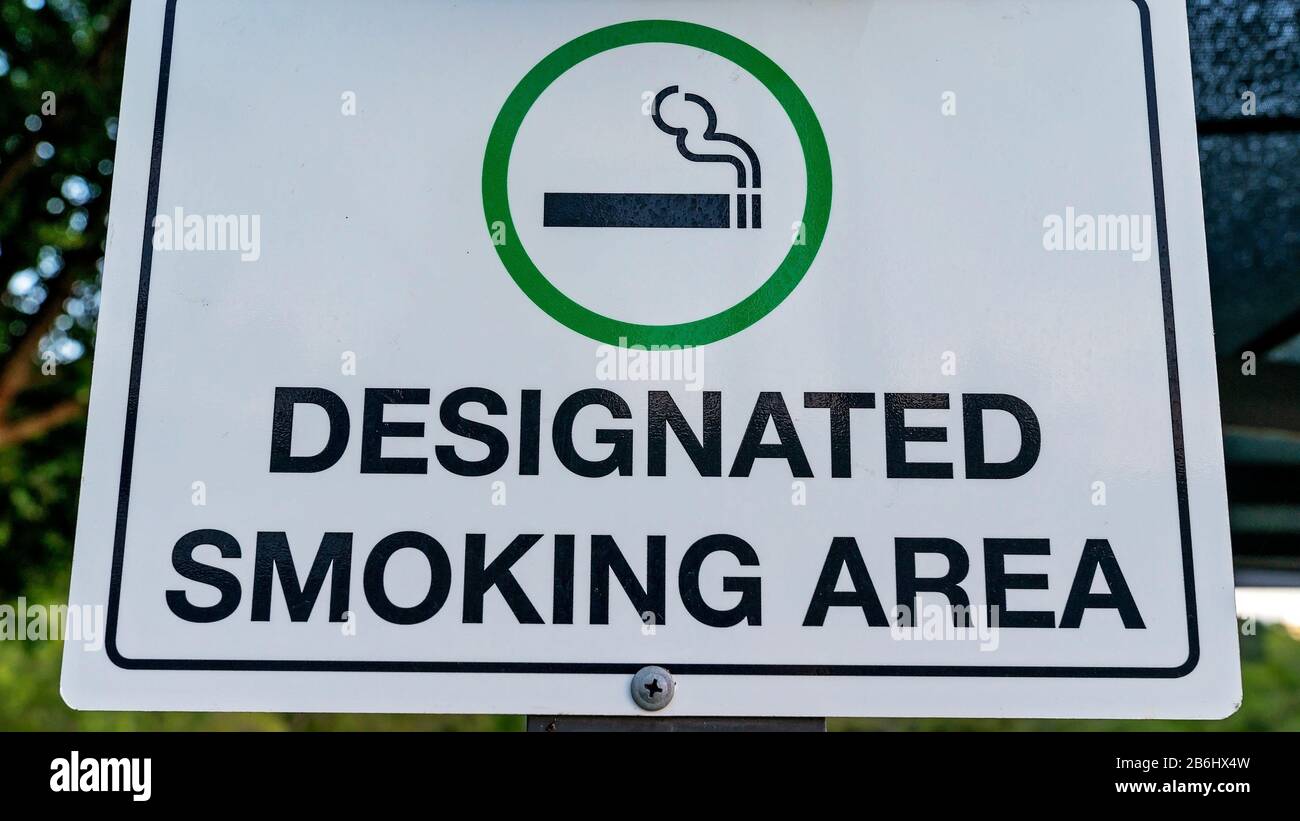 Designated Smoking Area signage with cigarette symbol Stock Photo - Alamy