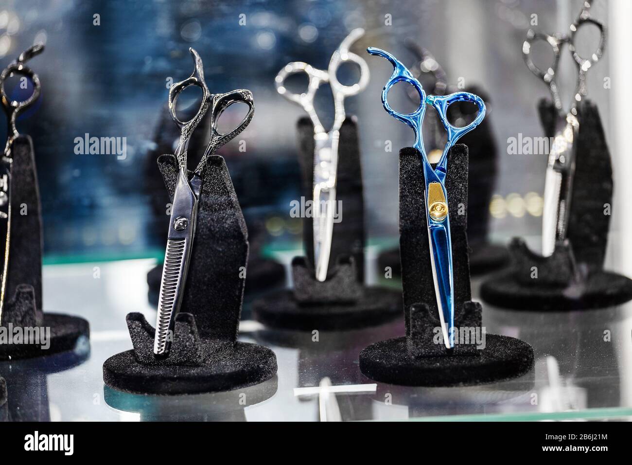 Professional expensive hairdressing scissors in the shop window ...