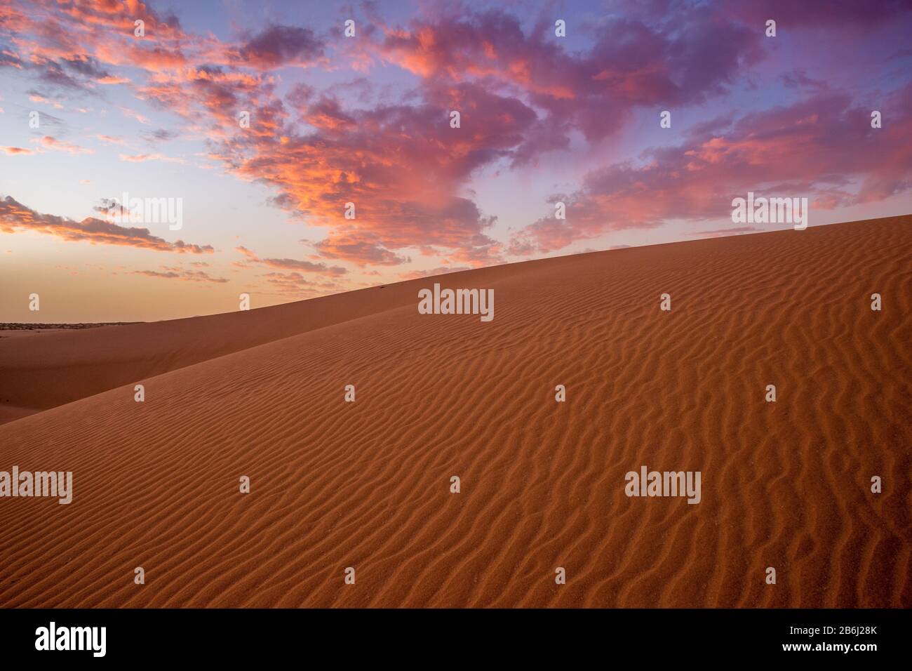 wonderful, dramatic sky over the sandy desert after sunset Stock Photo ...