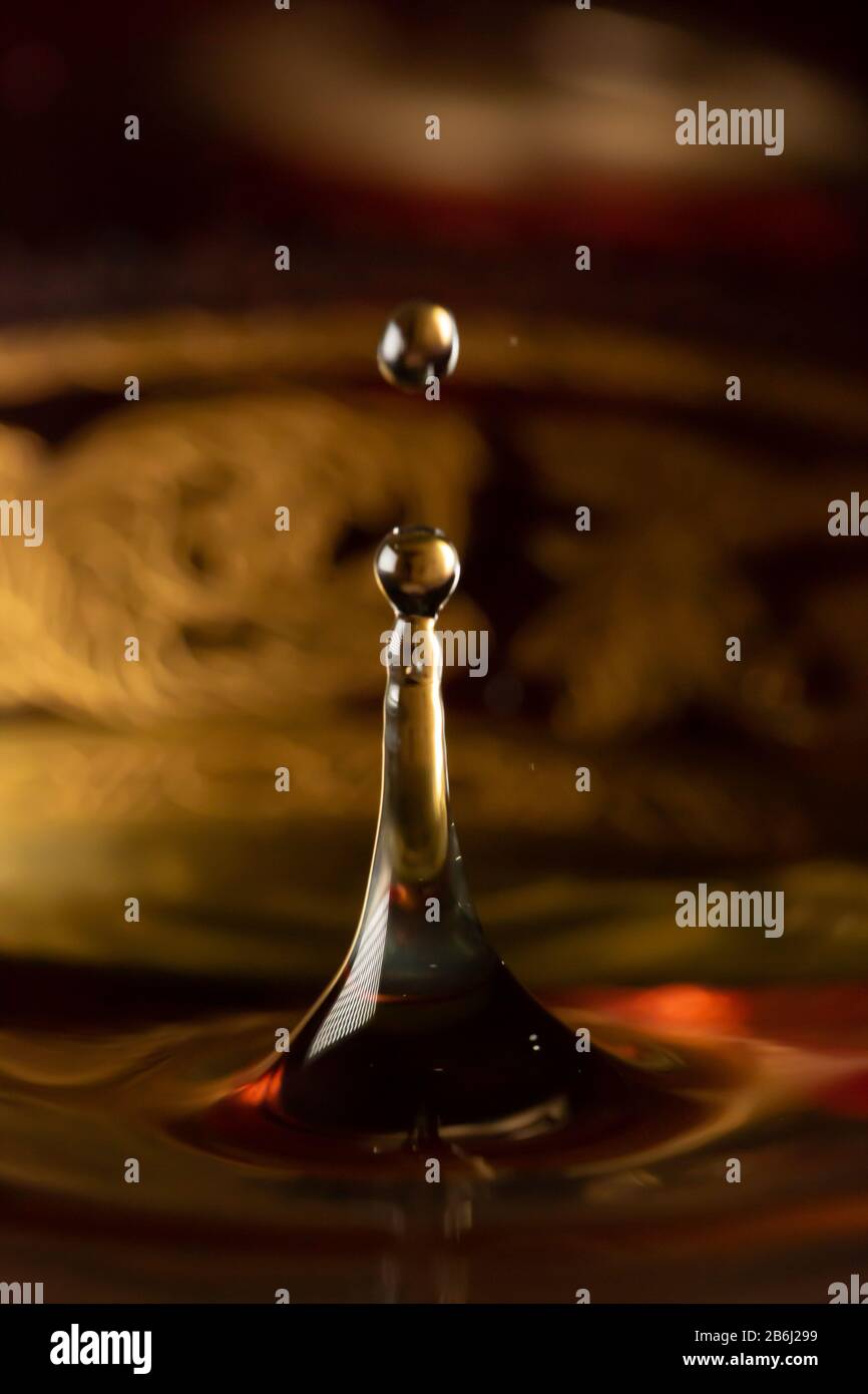 drops bouncing in the water Stock Photo - Alamy