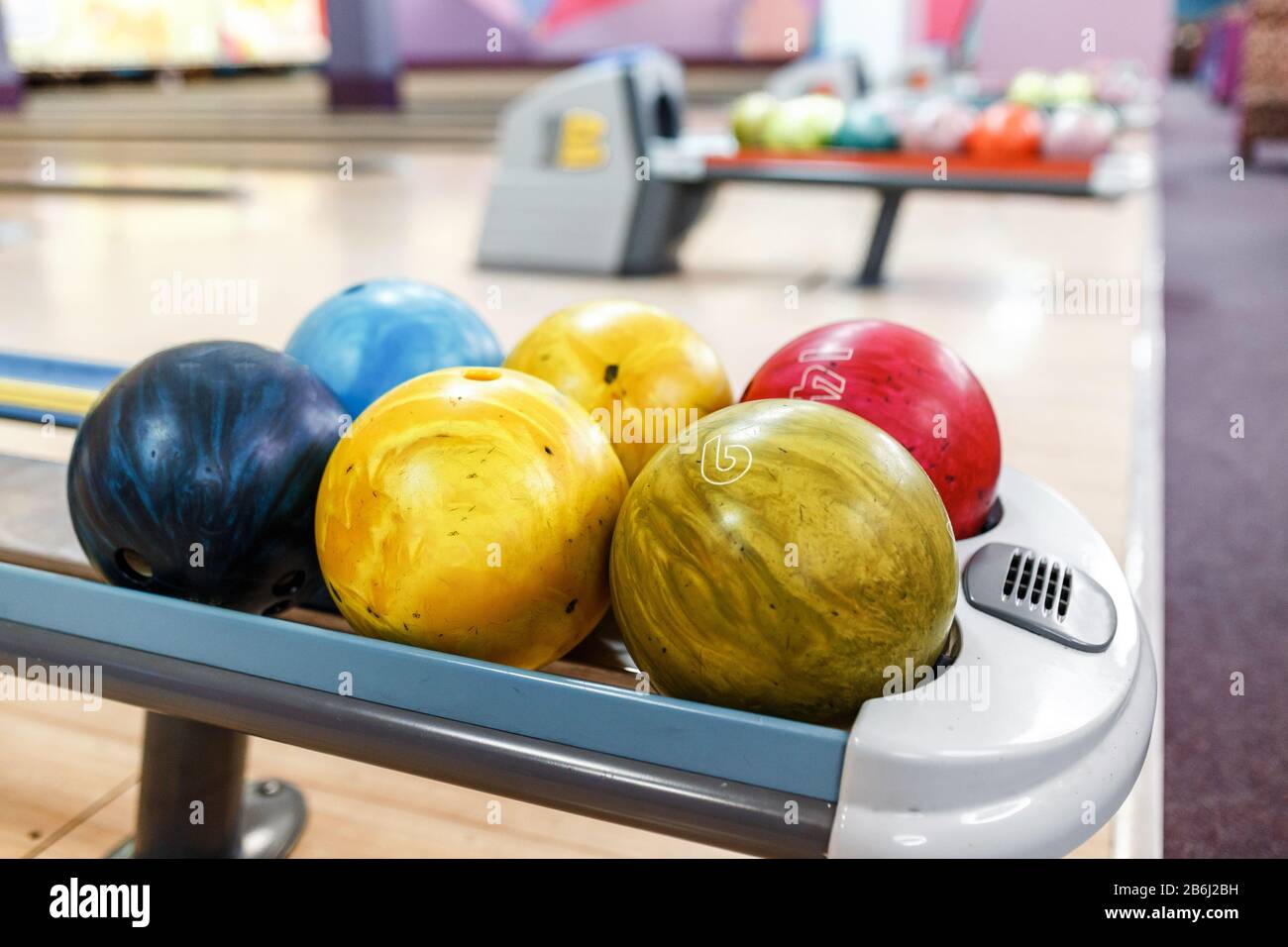 Set of bright colorful bowling balls waiting for player Stock Photo - Alamy