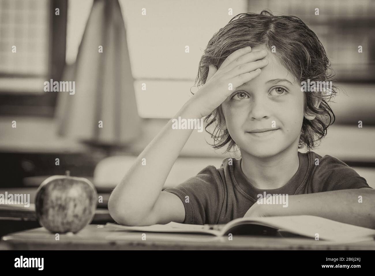 Boy thinking desk High Resolution Stock Photography and Images - Alamy