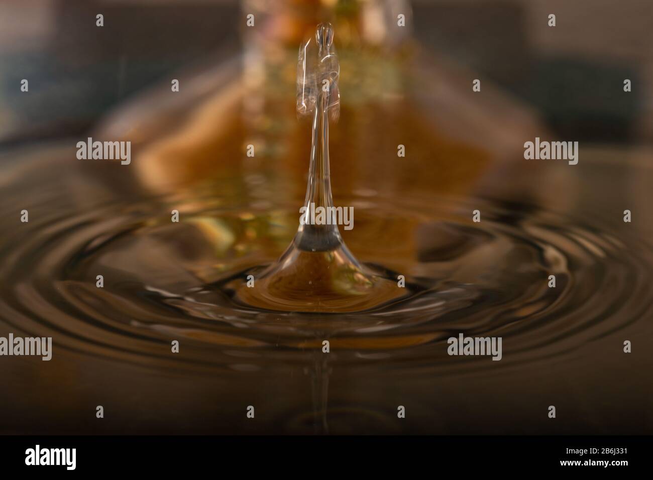 drops bouncing in the water Stock Photo - Alamy