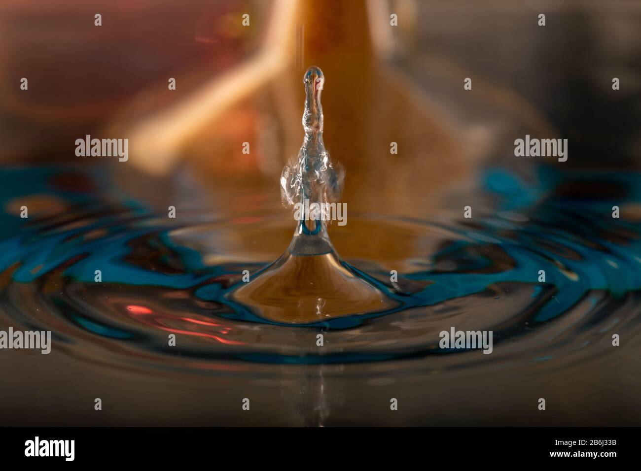 drops bouncing in the water Stock Photo - Alamy
