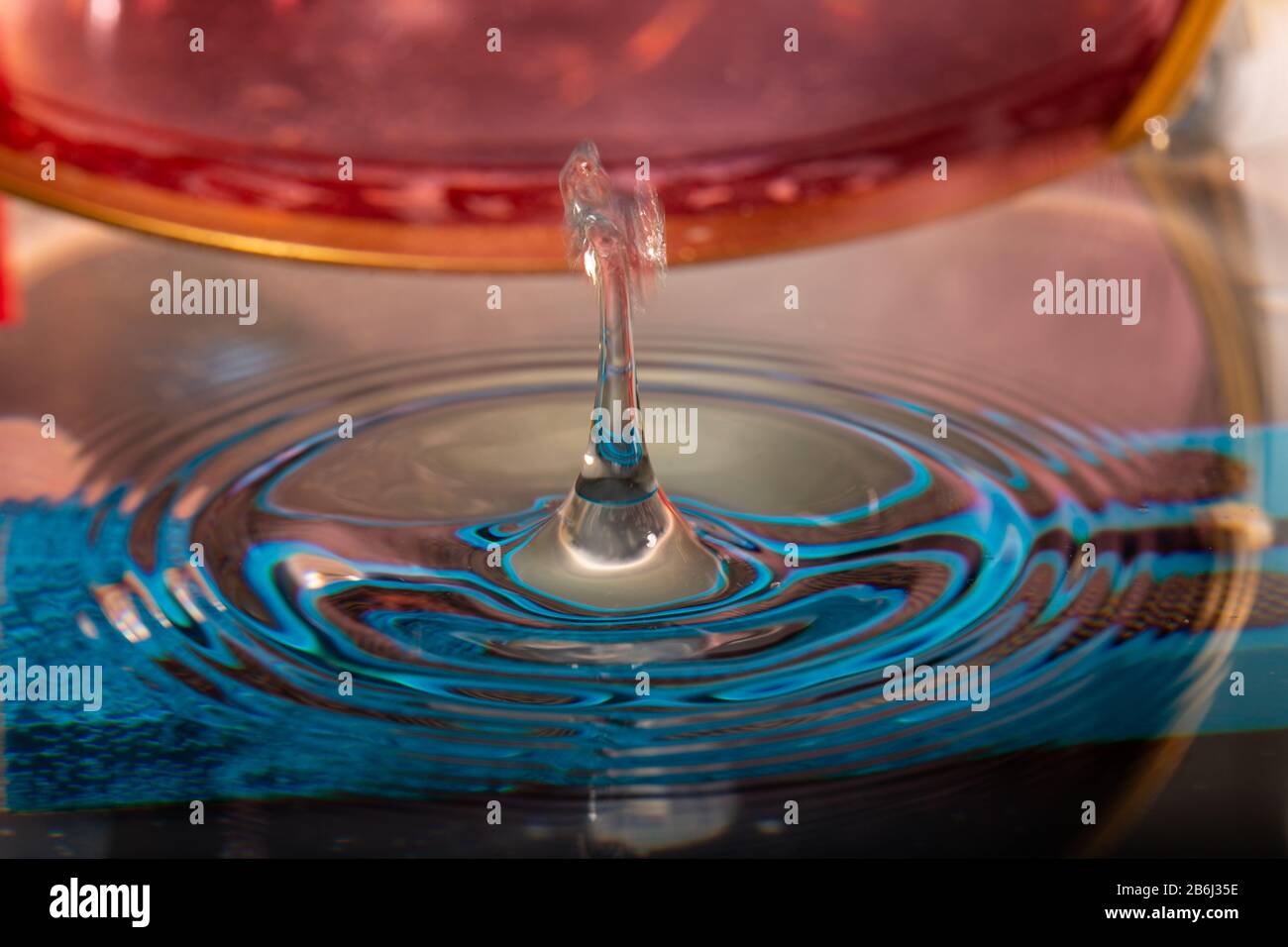 drops bouncing in the water Stock Photo - Alamy