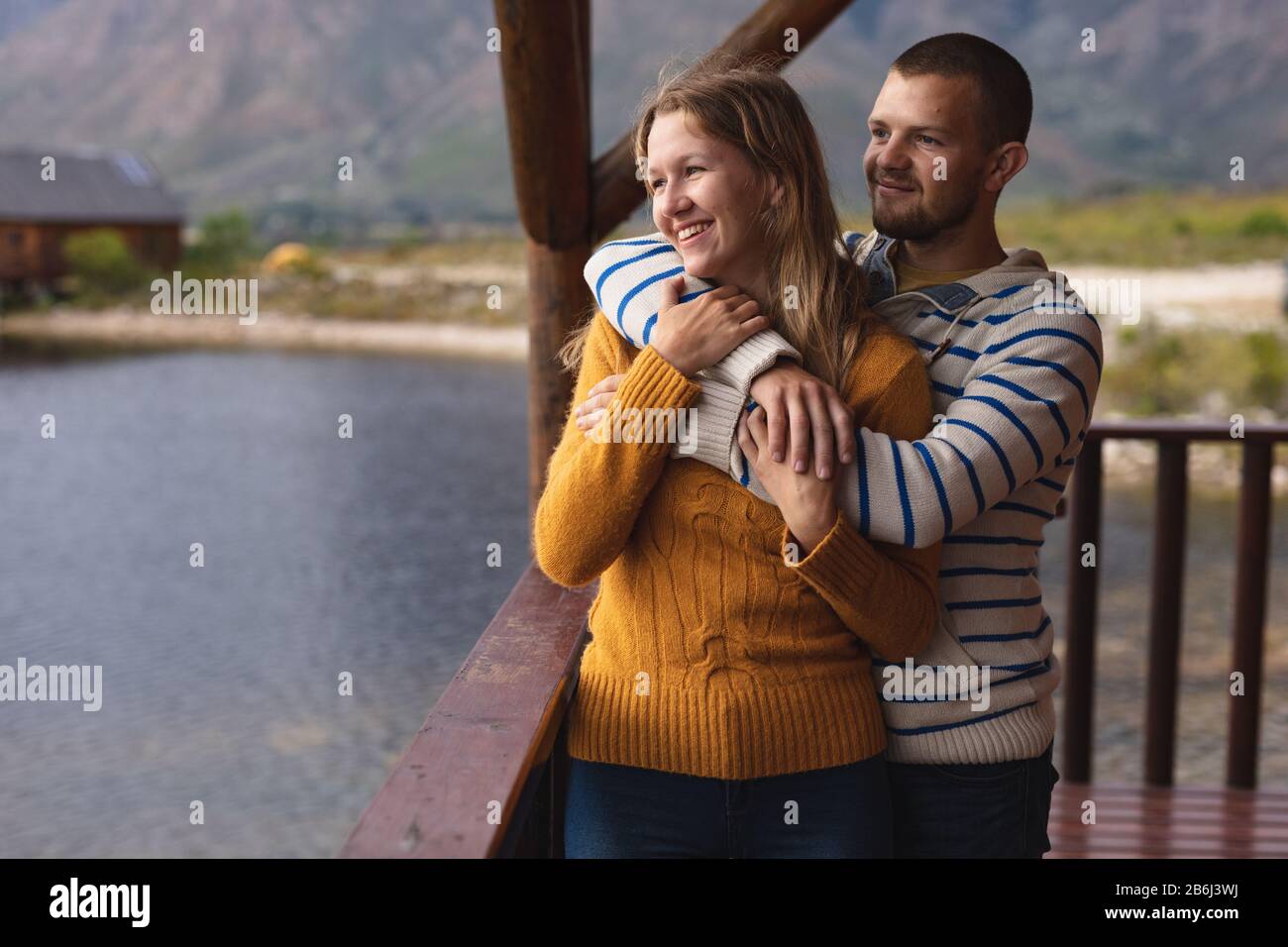 Back view young embracing couple hi-res stock photography and images ...