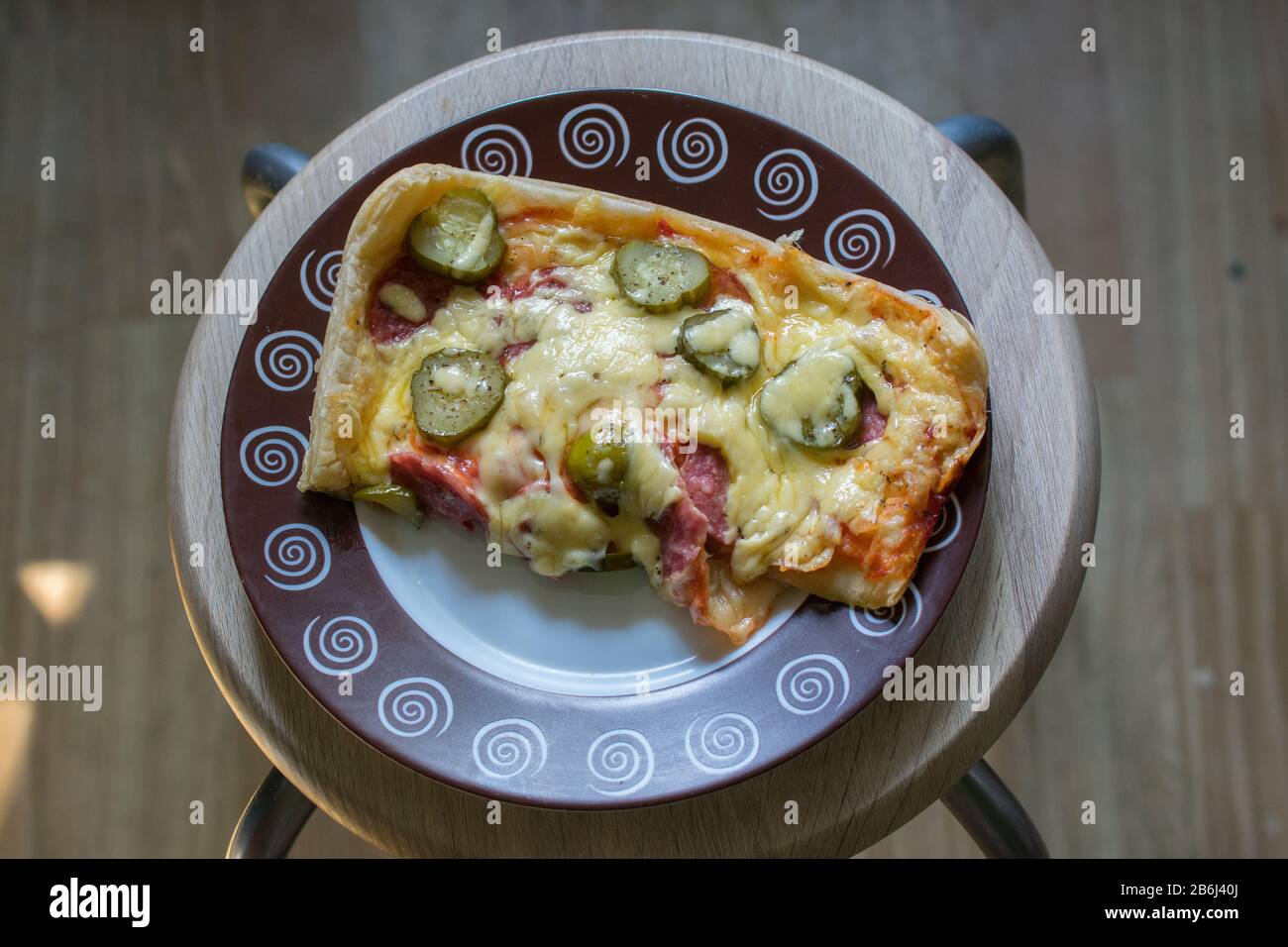 Slice of rectangular shaped home made pizza on plate Stock Photo - Alamy