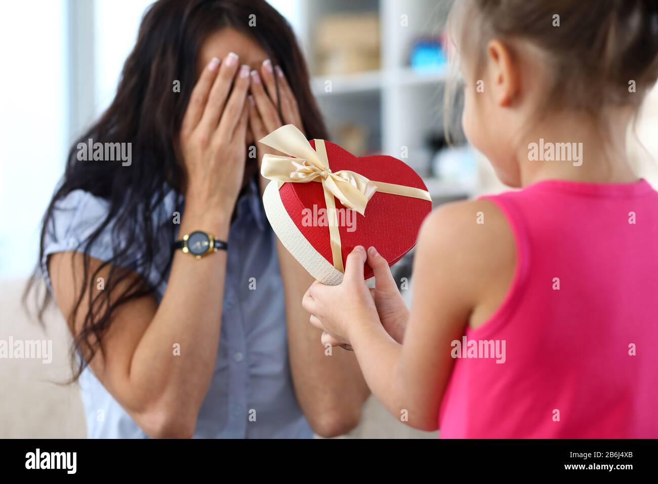 Child giving present hi-res stock photography and images - Alamy