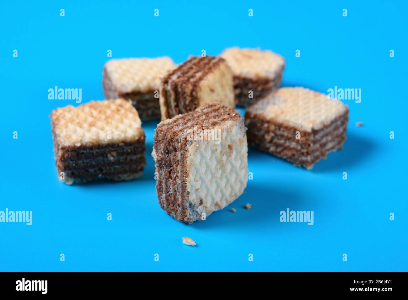 chocolate wafer blocks on a blue background Stock Photo - Alamy