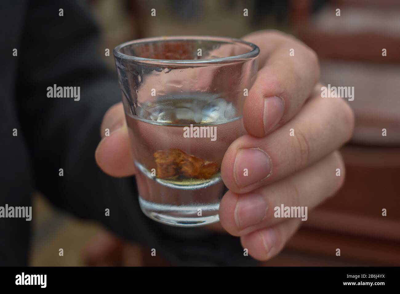 Hand and vodka shot glass hi-res stock photography and images - Alamy