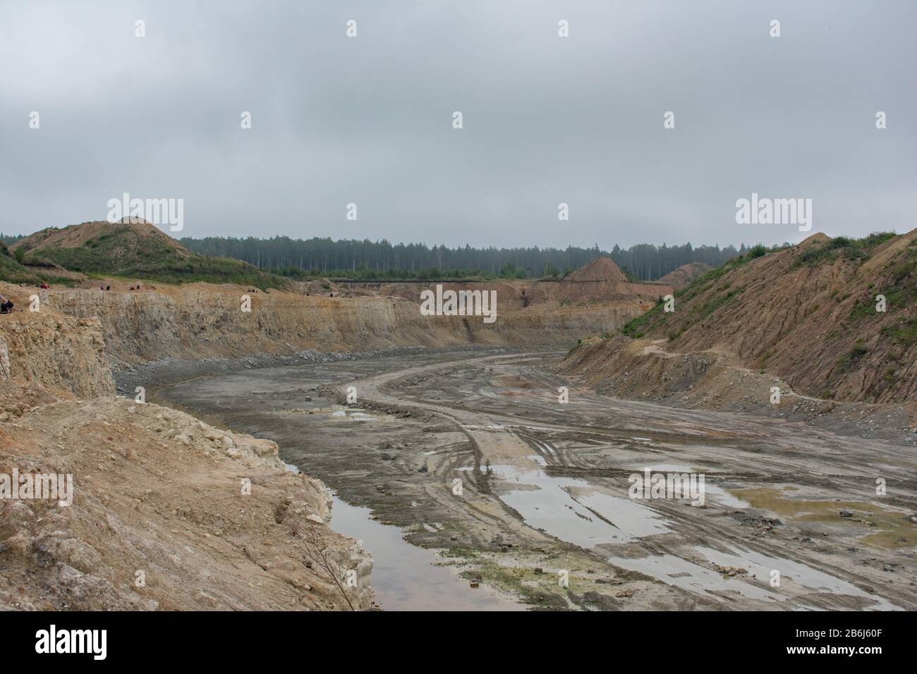 Landscape view of limestone quarry with high cliffs and canyons, and ...