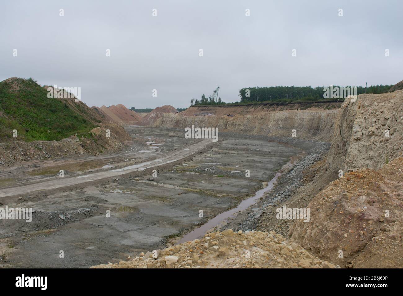 Landscape view of limestone quarry with high cliffs and canyons, and ...