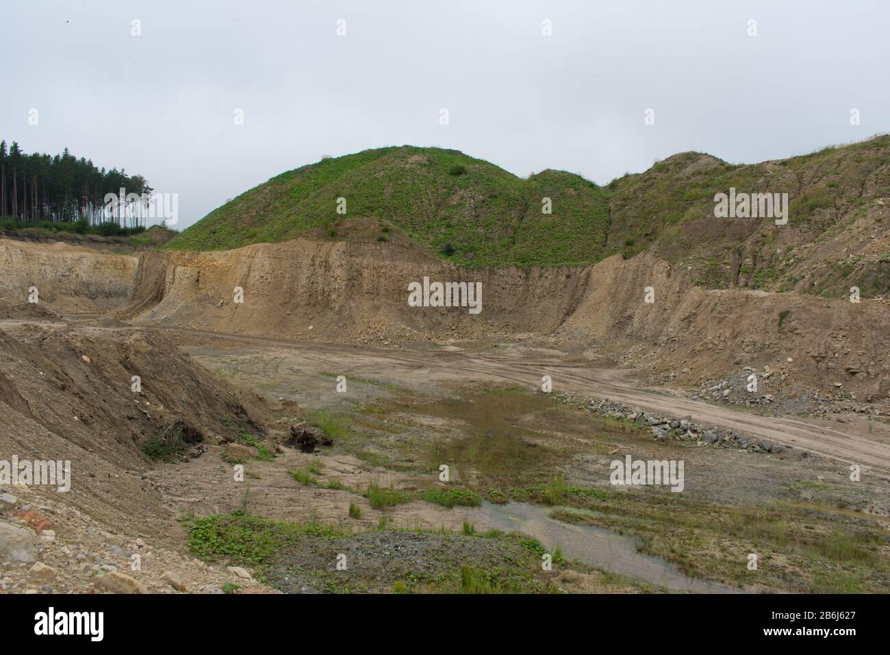 Landscape view of limestone quarry with high cliffs and canyons, and ...