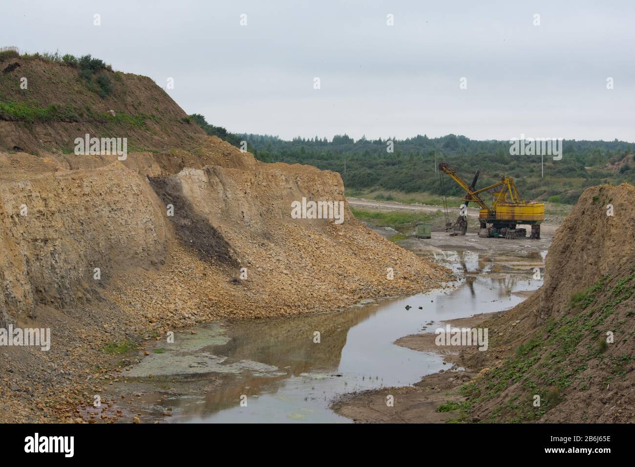 Landscape view of limestone quarry with large excavator machinery, high ...